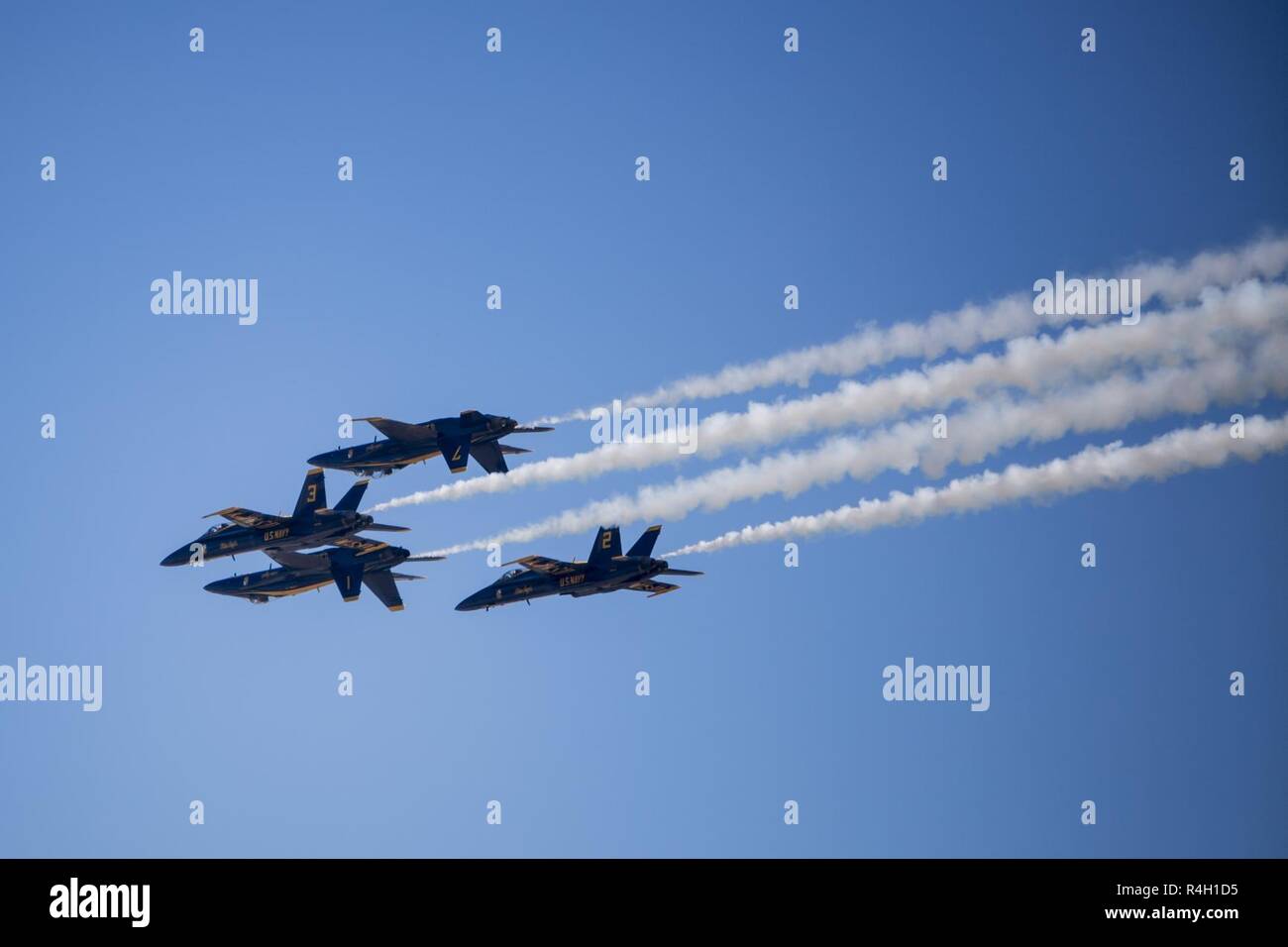 Four F/A-18 Hornets with the U.S. Navy Blue Angels perform a dynamic ...