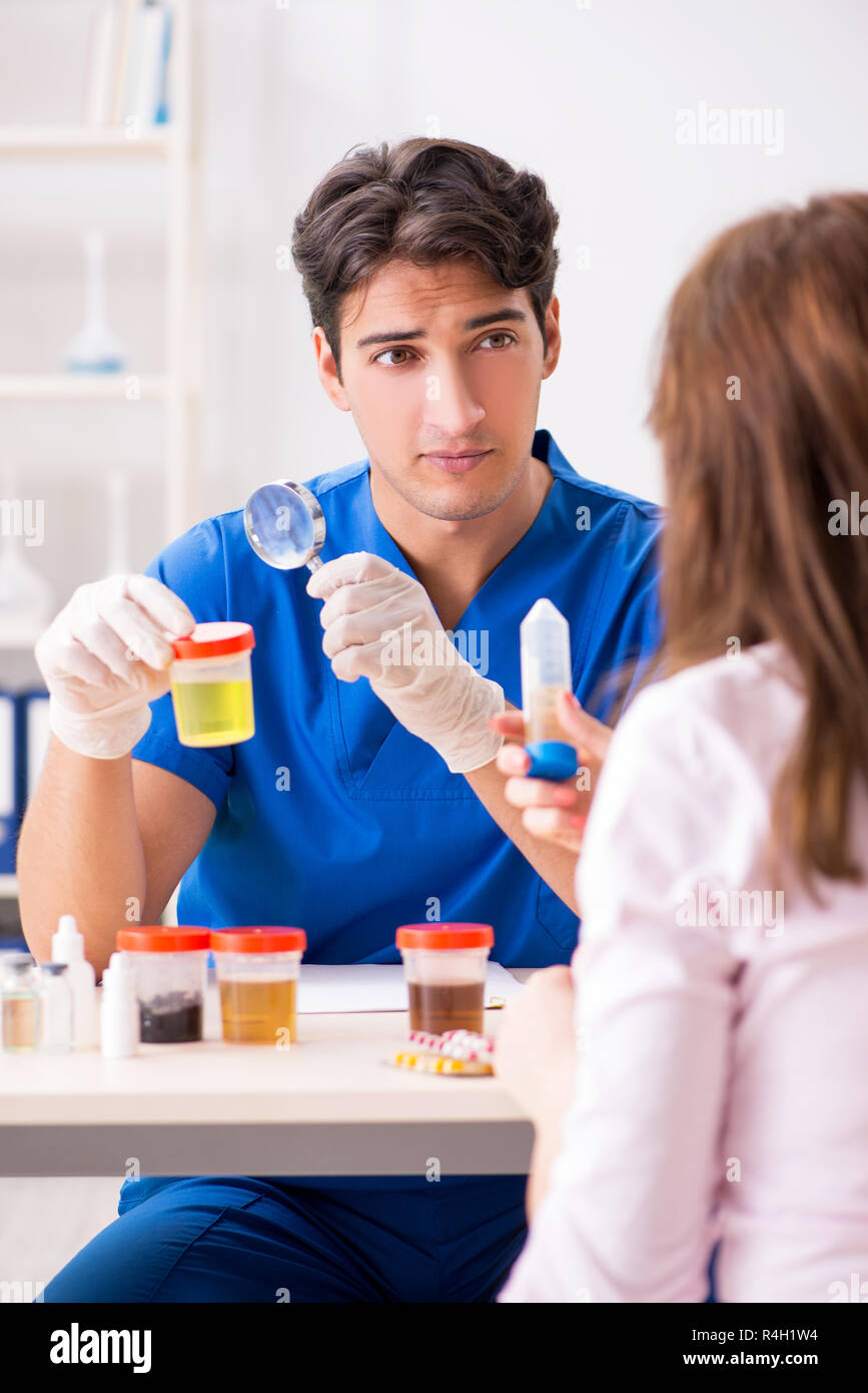 Patient visiting doctor for urine test Stock Photo - Alamy