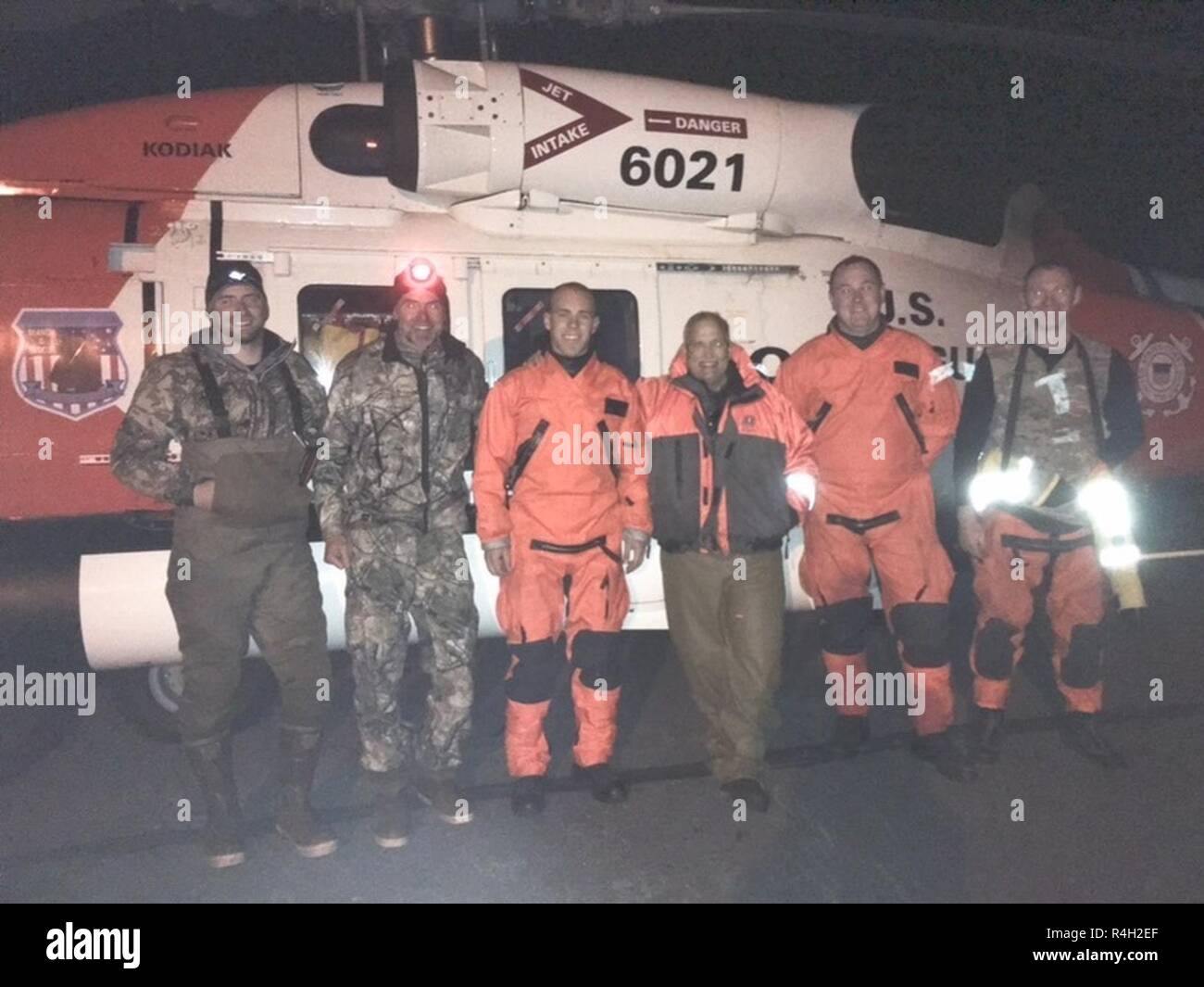 A Coast Guard MH-60 Jayhawk helicopter crew from Air Station Kodiak ...