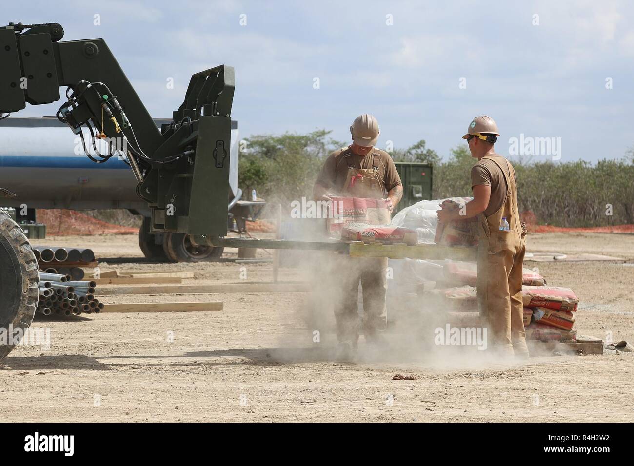 U.S. Navy Equipment Operator Chief Dennis Hill (left) and Construction ...