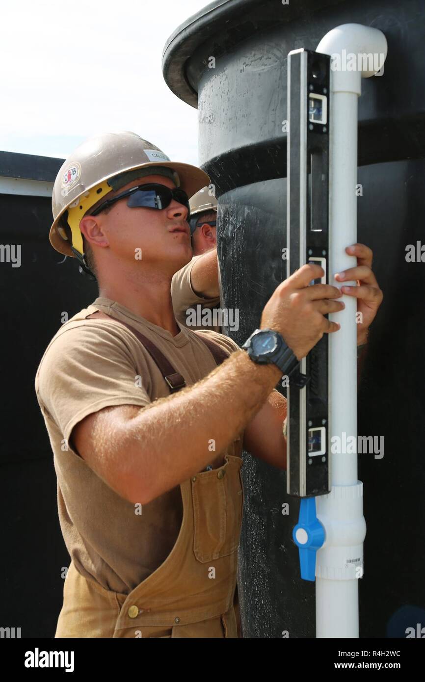 U.S. Navy Utilitiesman 2nd Class Anthony Calleja, assigned to Naval ...