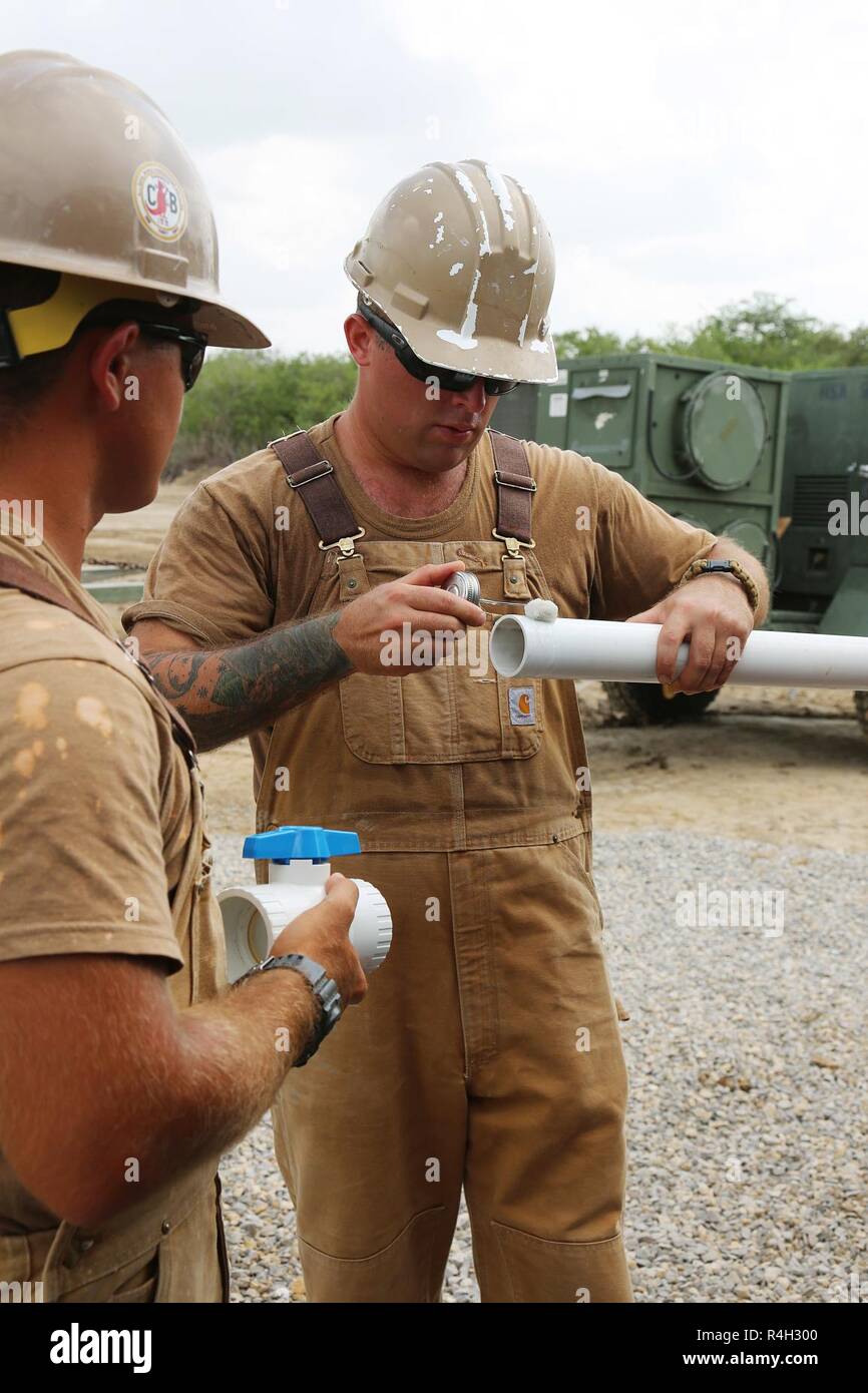U.S. Navy Utilitiesman 2nd Class Patrick Cannon, assigned to Naval ...