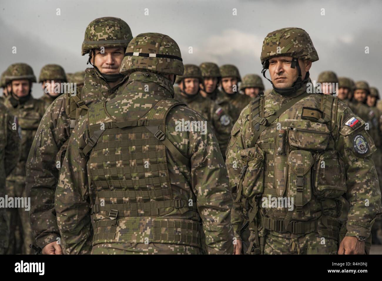 Slovak Soldiers report to their commander during the opening ceremony ...