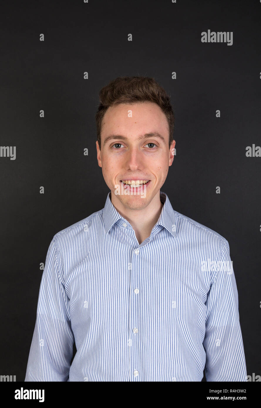 portrait of smart looking young man Stock Photo - Alamy