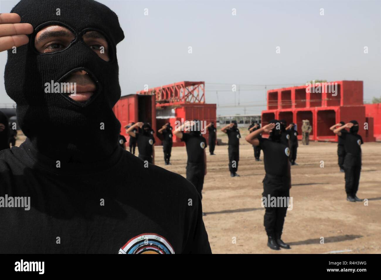 Iraqi Counter Terrorism Service (CTS) members stand in formation and ...