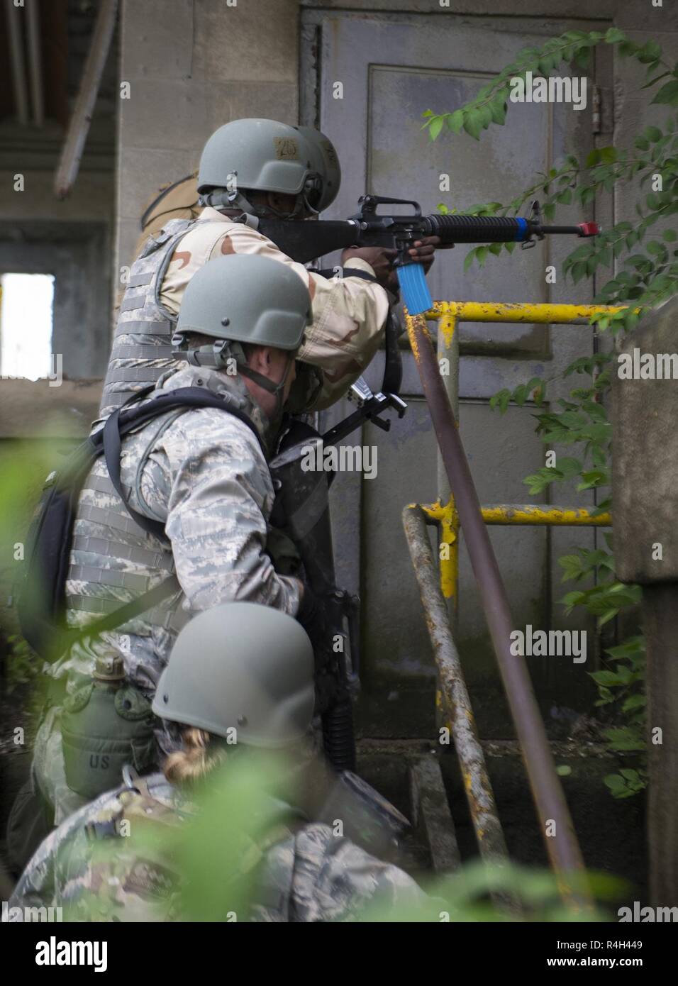 Airman move to breach the door of a suspected bomb factory while ...