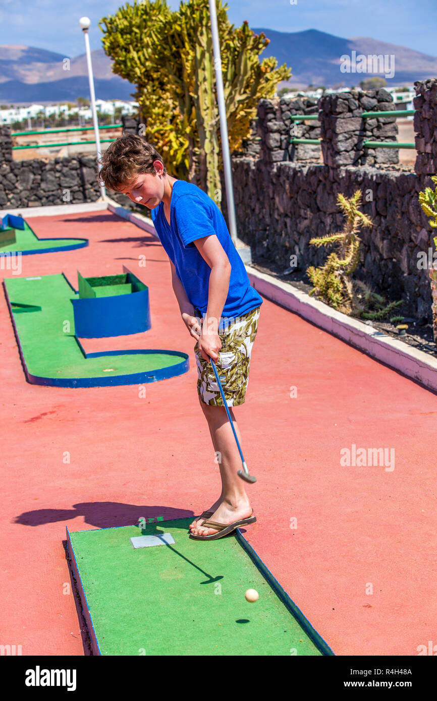 boy loves to play Mini-Golf Stock Photo - Alamy