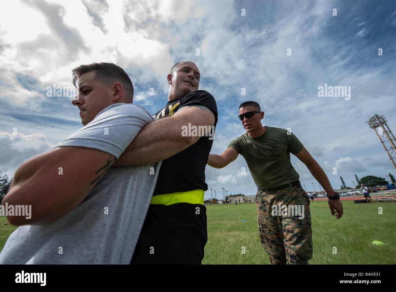 U.S. Army Spc. Tanner Moran, carries U.S. Air Force Staff Sgt. Colin ...