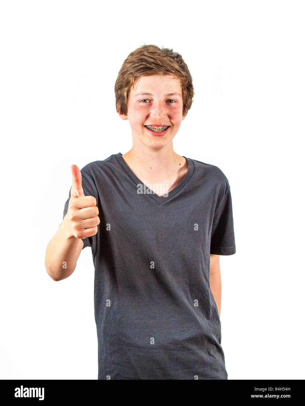 boy with retainer smiles and gives thumbs up sign Stock Photo - Alamy