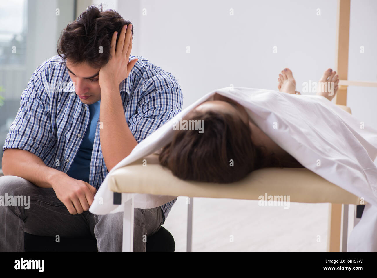 Man mourning his dead wife Stock Photo - Alamy