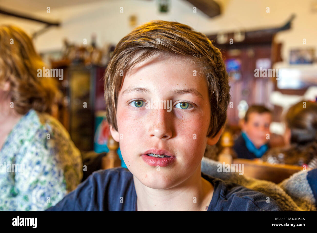 cute young boy in a restaurant Stock Photo - Alamy