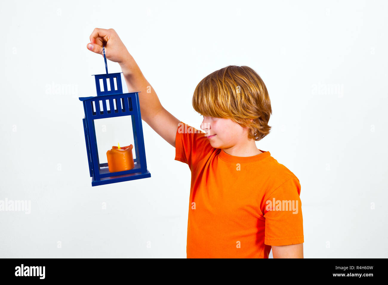 cute boy holding a hand lantern Stock Photo - Alamy