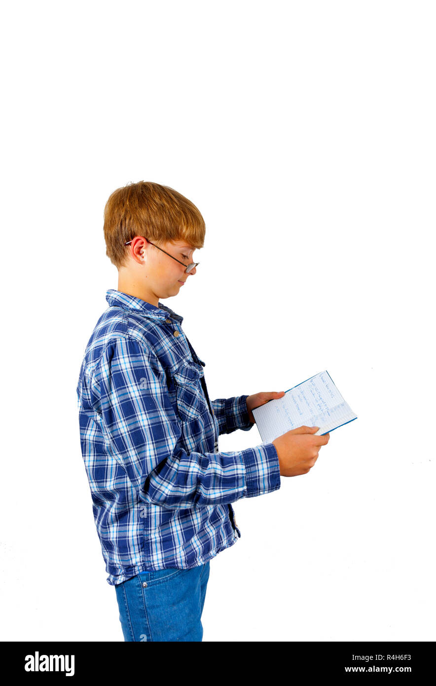 happy smart boy is reading in a book Stock Photo - Alamy
