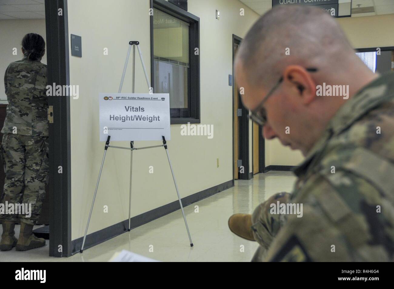 U.S. Army Reserve Soldiers wait in line to get their vitals done during ...