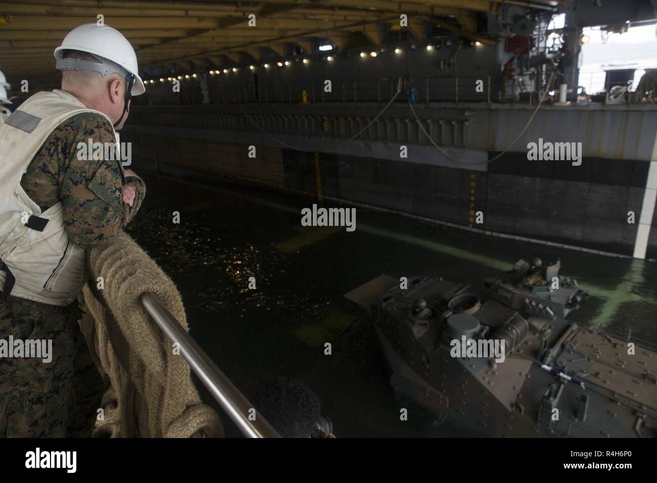 U.S. Marine Brig. Gen. Chris McPhillips watches as members of the Japan ...