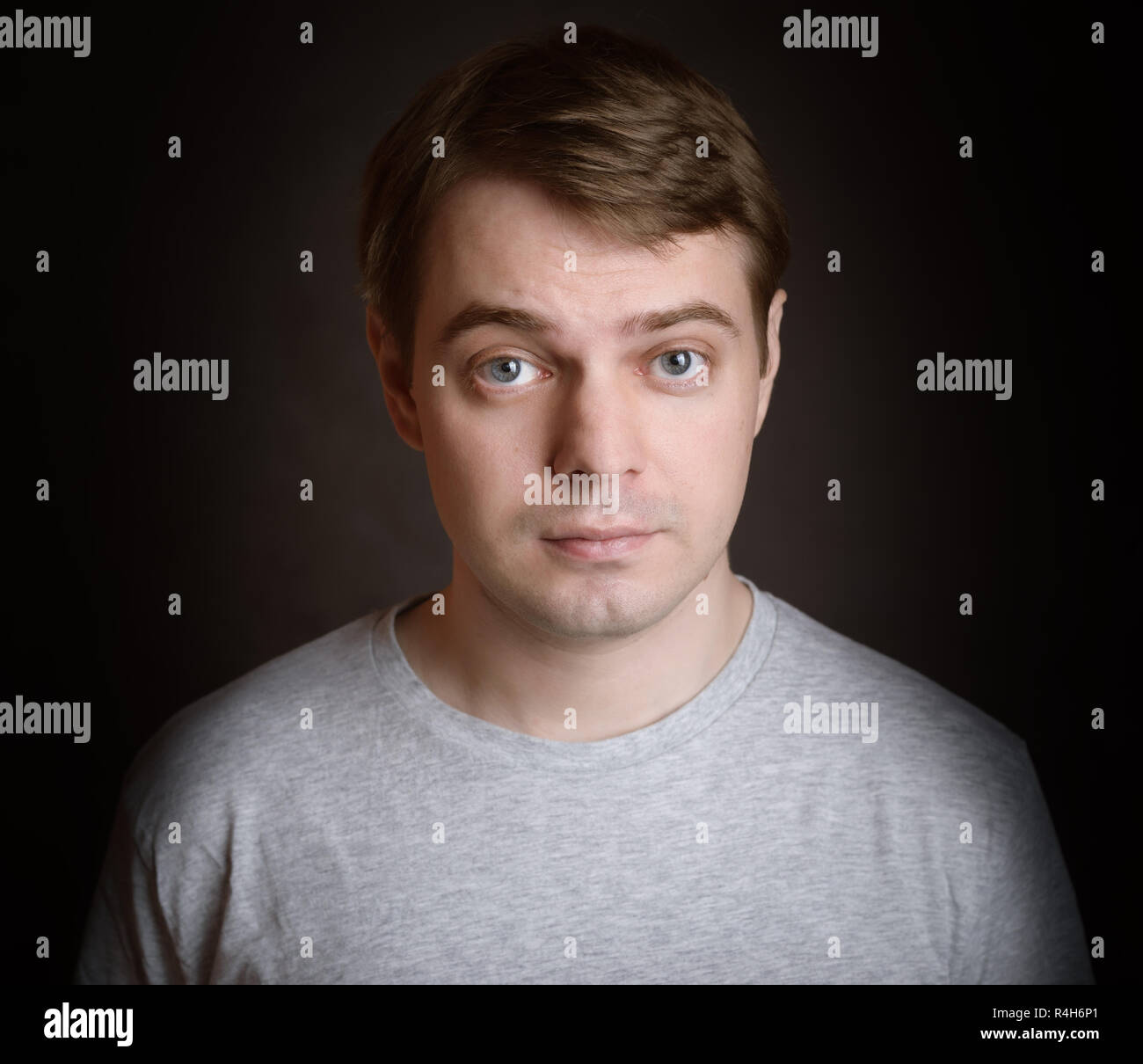 Portrait of a sad man with blue eyes Stock Photo - Alamy