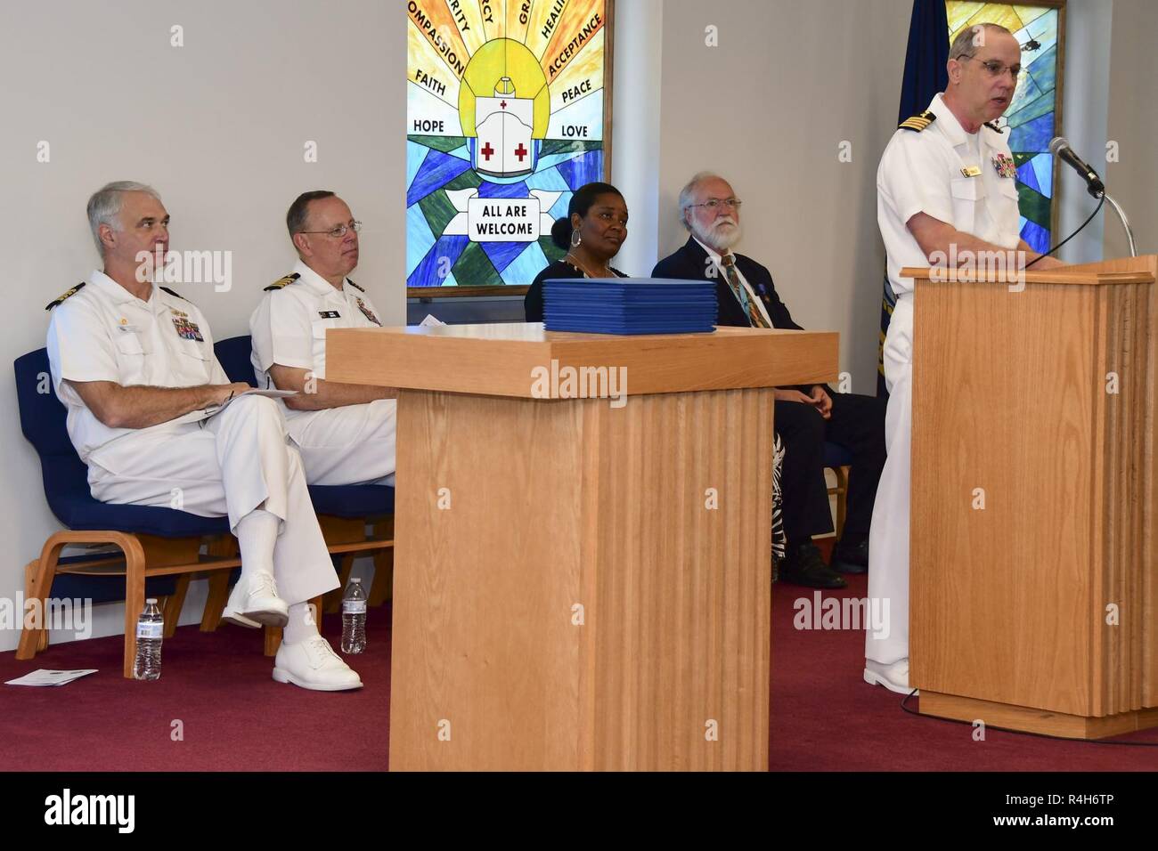 Capt. James Denley, staff chaplain, introduces Capt. Christopher Culp ...