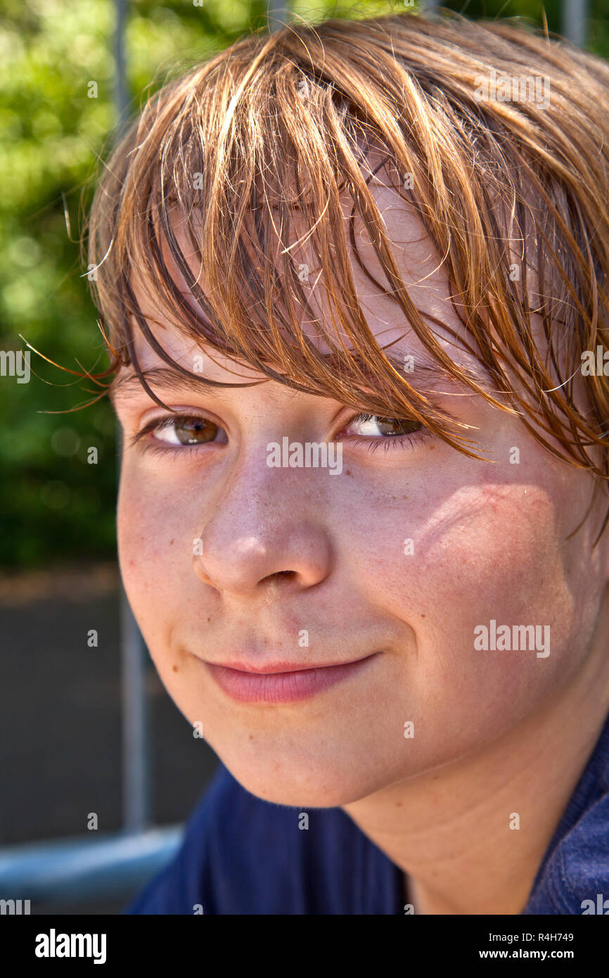 young happy boy sweating and exhausted from sports Stock Photo - Alamy