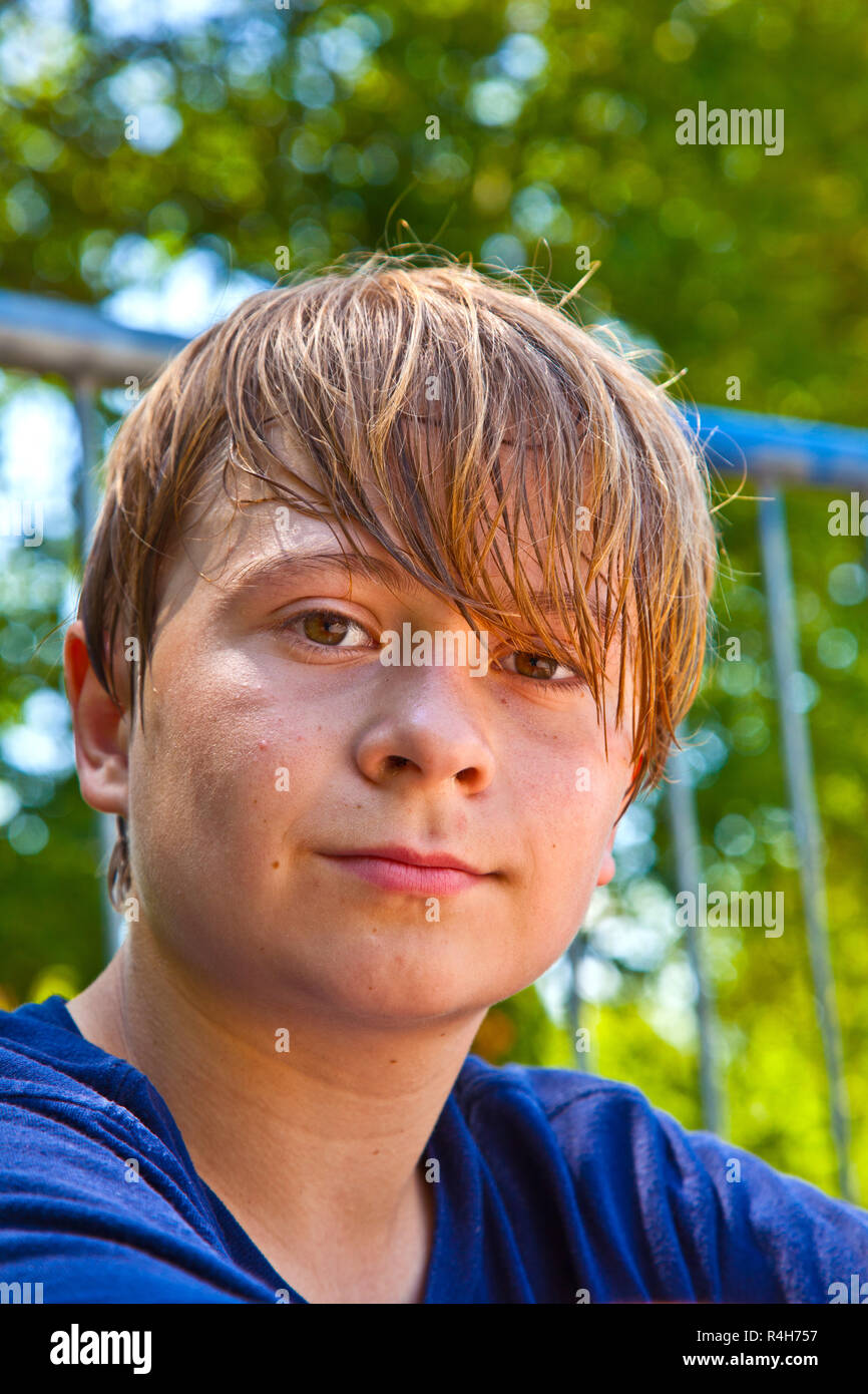 young happy boy sweating and exhausted from sports Stock Photo - Alamy