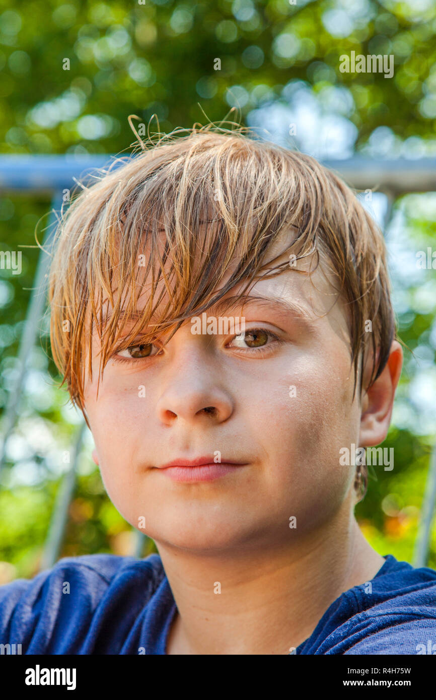 young happy boy sweating and exhausted Stock Photo - Alamy