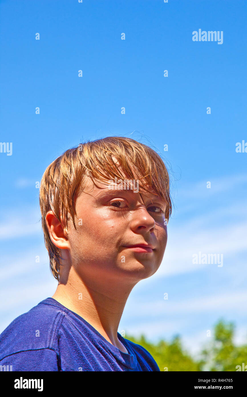 young happy boy sweating and exhausted from sports Stock Photo - Alamy