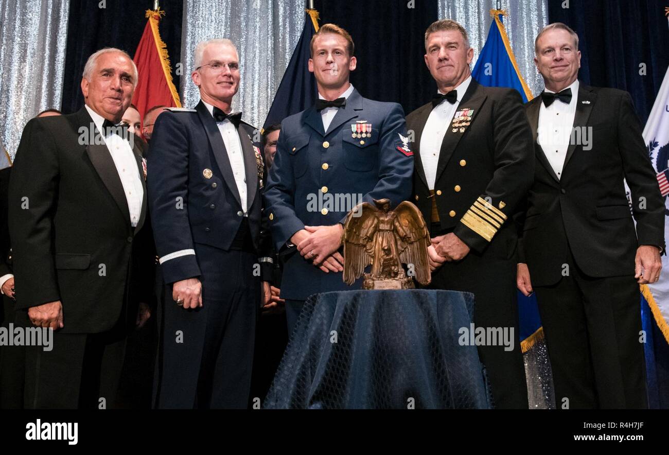 Coast Guard Commadant Adm. Karl L. Schultz, presents the Angel of the ...