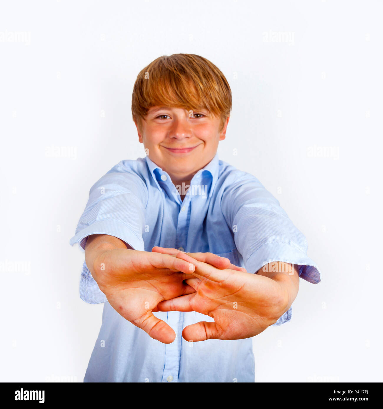 cute young happy boy shows his hands Stock Photo - Alamy