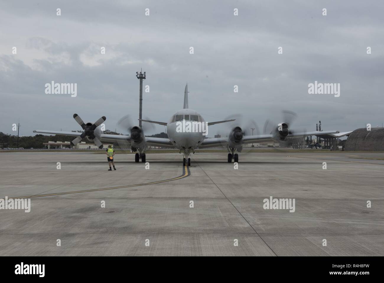 A Royal Australian Air Force member performs pre-flight activities for ...