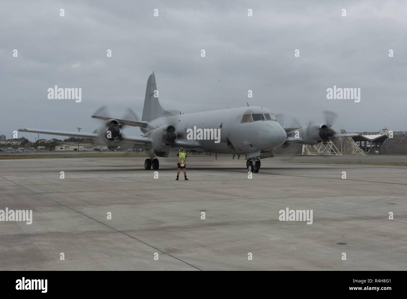 A Royal Australian Air Force member performs pre-flight activities for ...