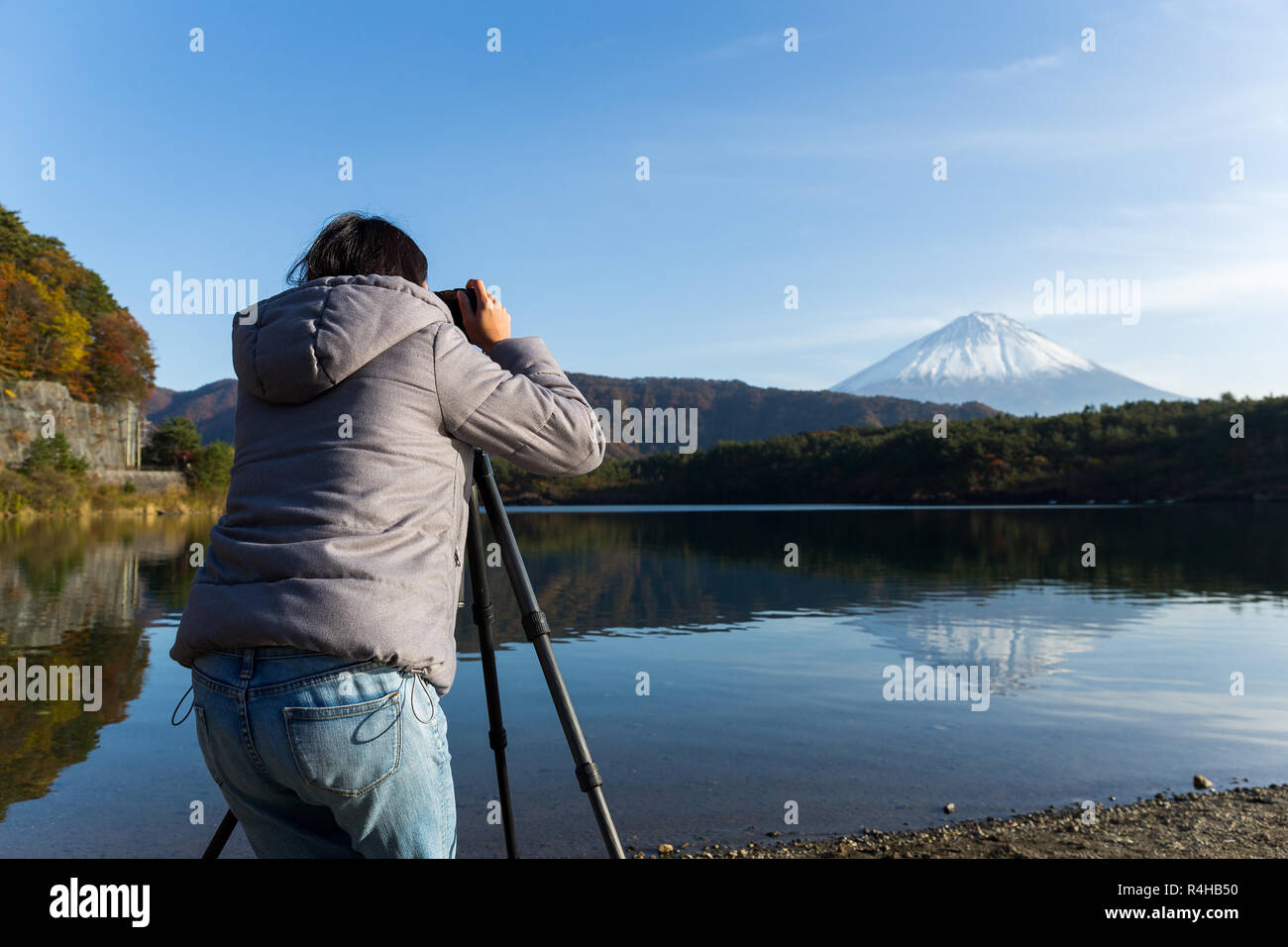 Woman taking photo on Mount Fuji Stock Photo - Alamy