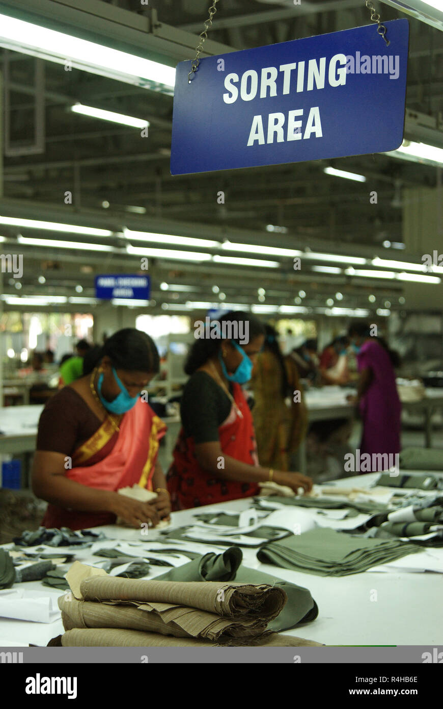 Woman sorting clothes Stock Photo - Alamy