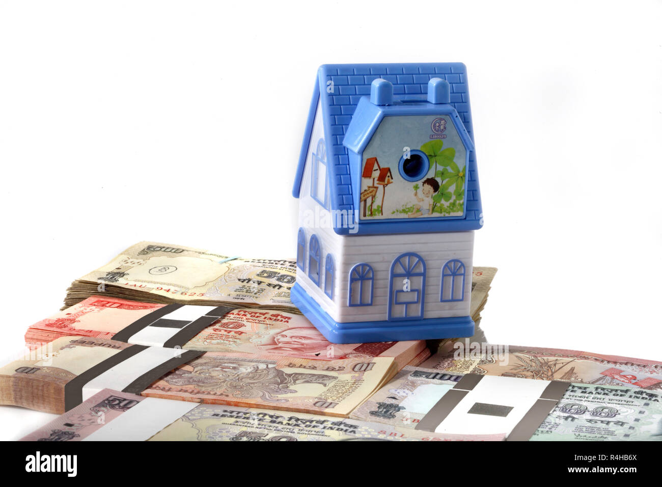 House on money stack Stock Photo - Alamy