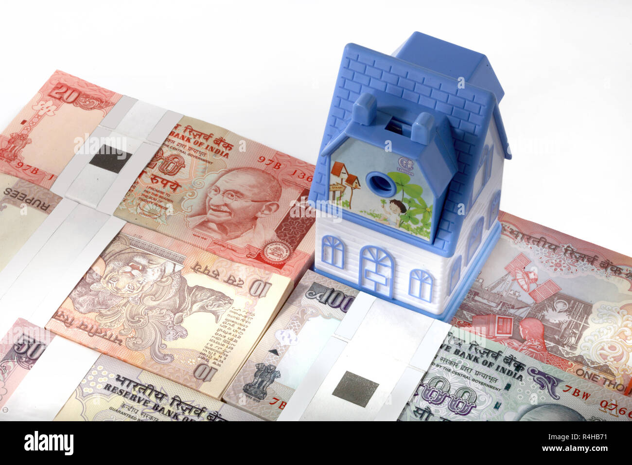 House on money stack Stock Photo - Alamy