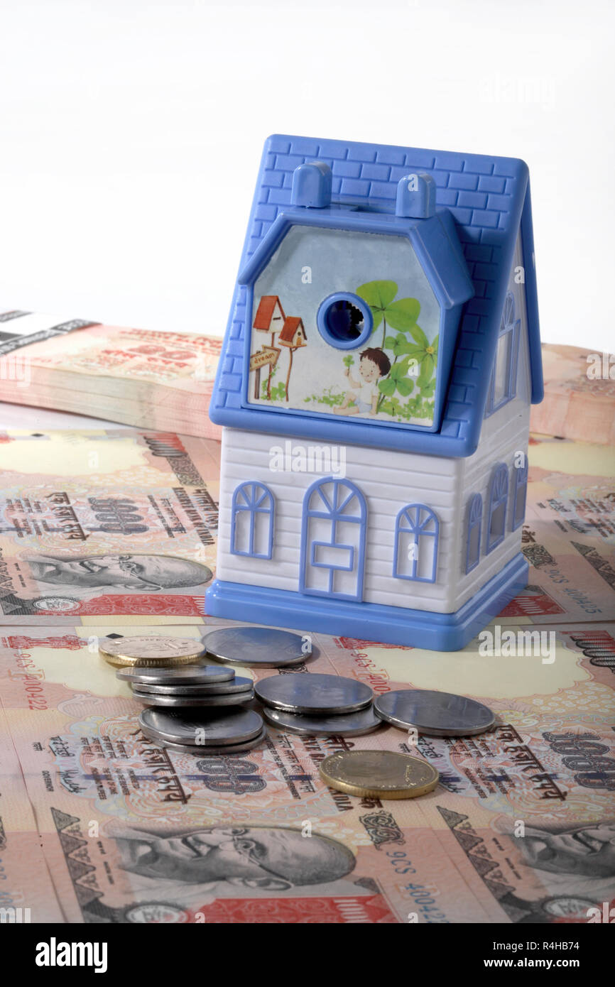 House and money stack Stock Photo - Alamy