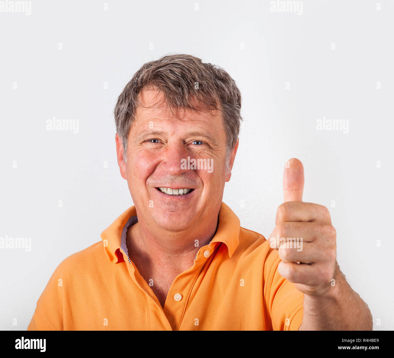 attractive man giving finger sign Stock Photo - Alamy