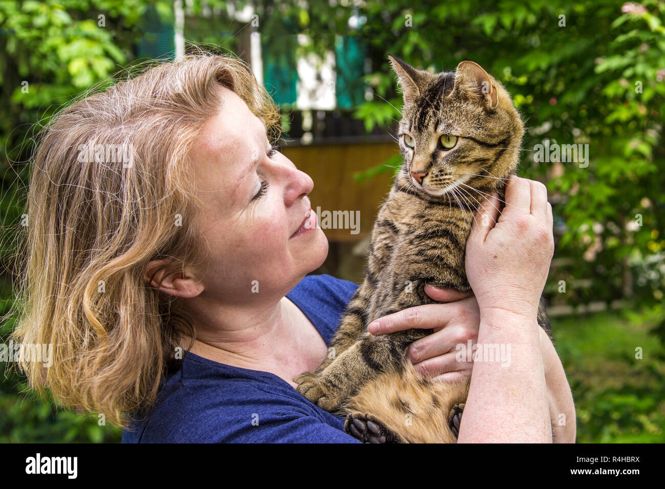 Woman hugging tiger hi-res stock photography and images - Alamy