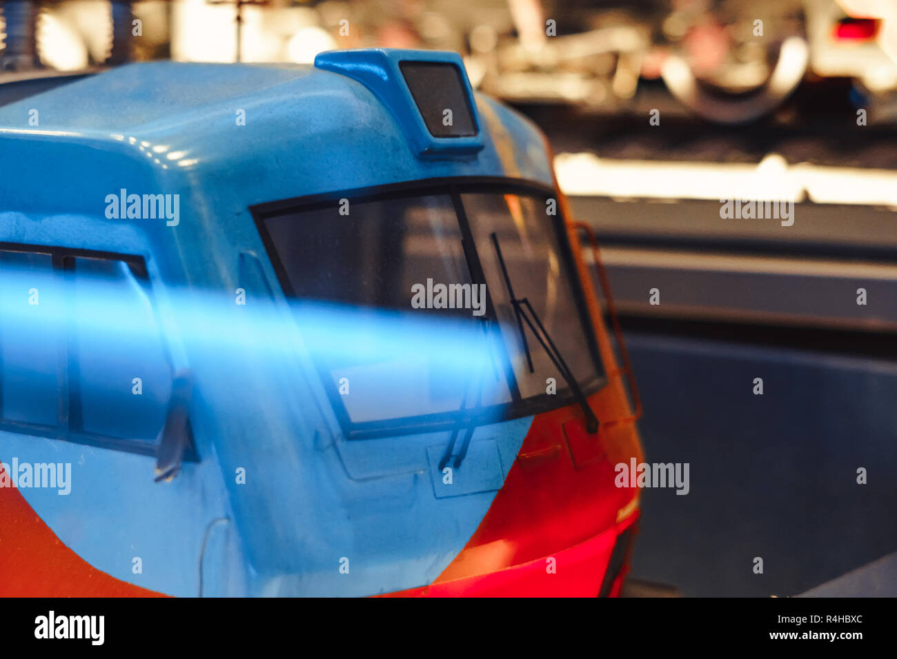 Miniature toy model of modern train crossing bridge Stock Photo - Alamy