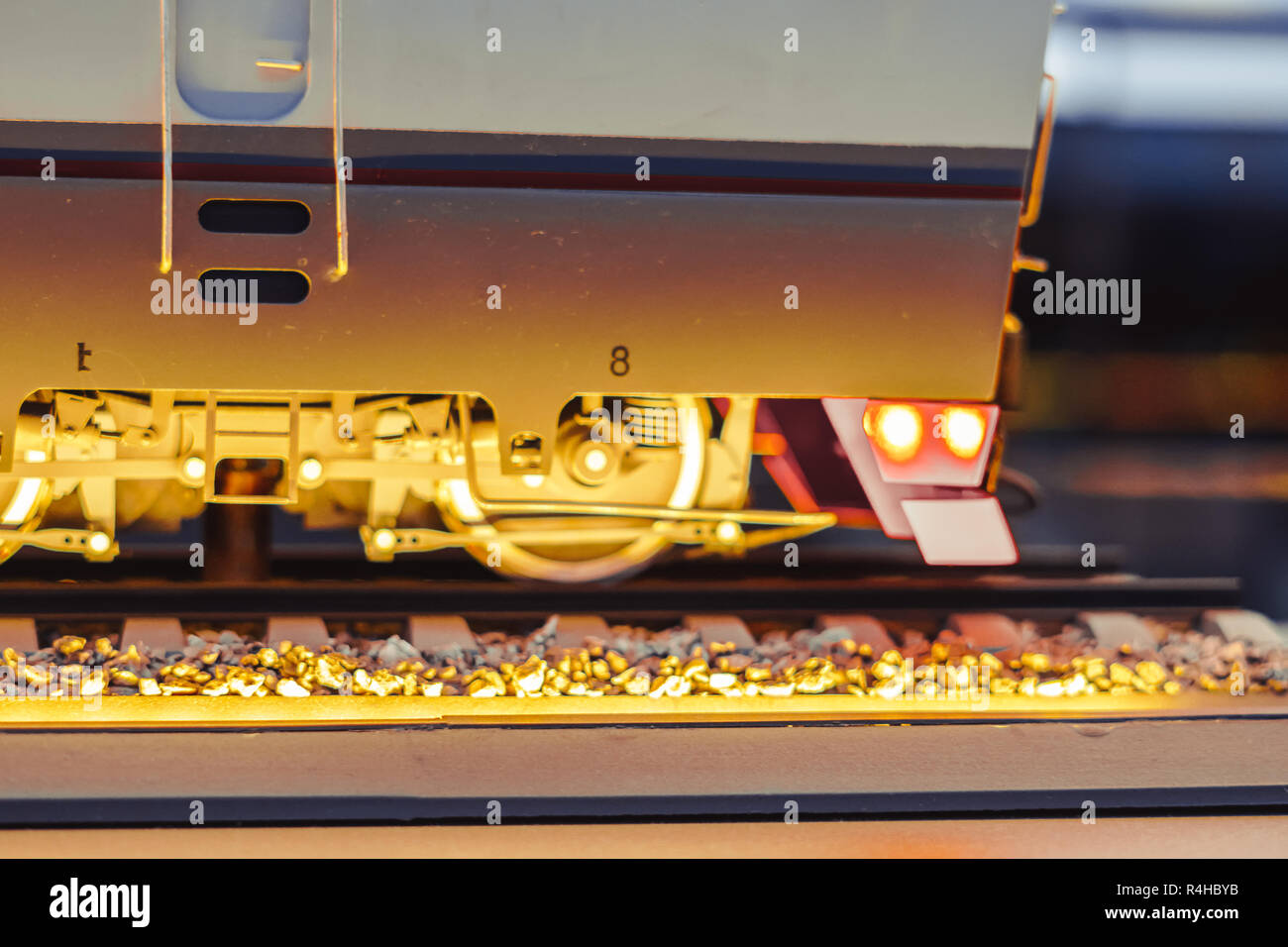 Miniature toy model of modern train crossing bridge Stock Photo - Alamy