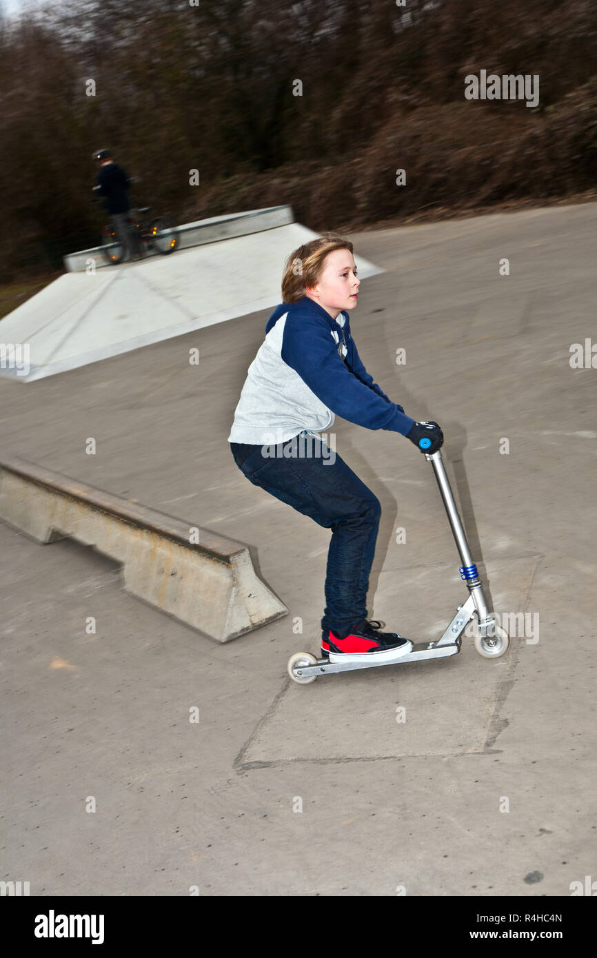 boy jumps over a ramp with his bike on the skate park Stock Photo - Alamy