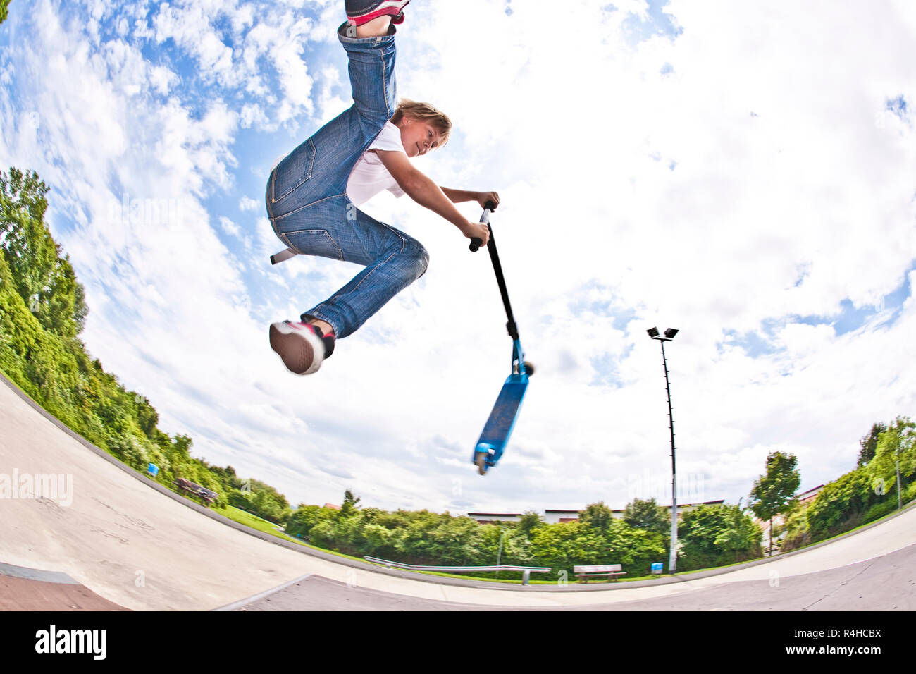 boy with scooter is going airborne Stock Photo - Alamy