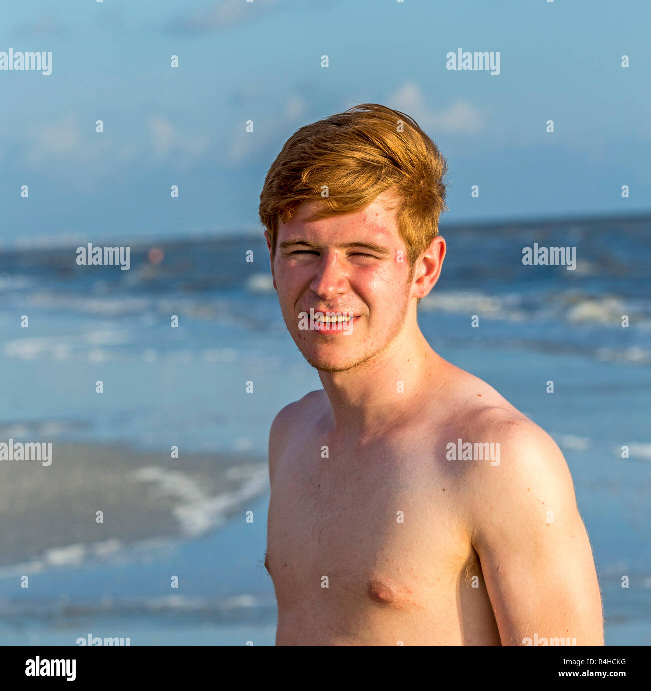 handsome confident teenager in sunset at the beach Stock Photo - Alamy