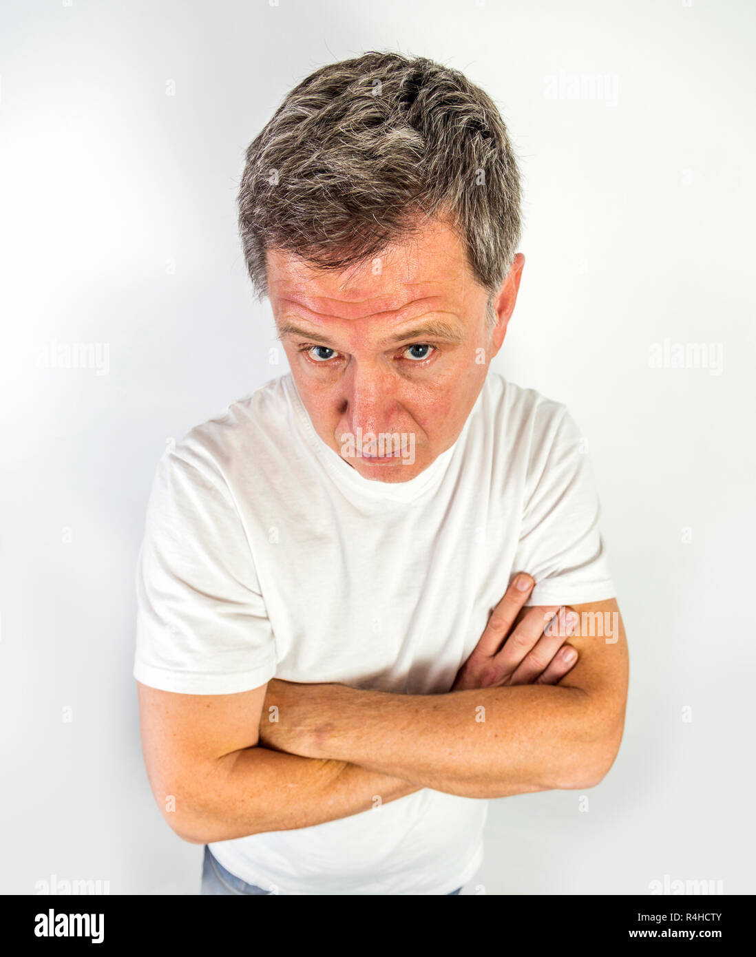 man with folded arms Stock Photo - Alamy