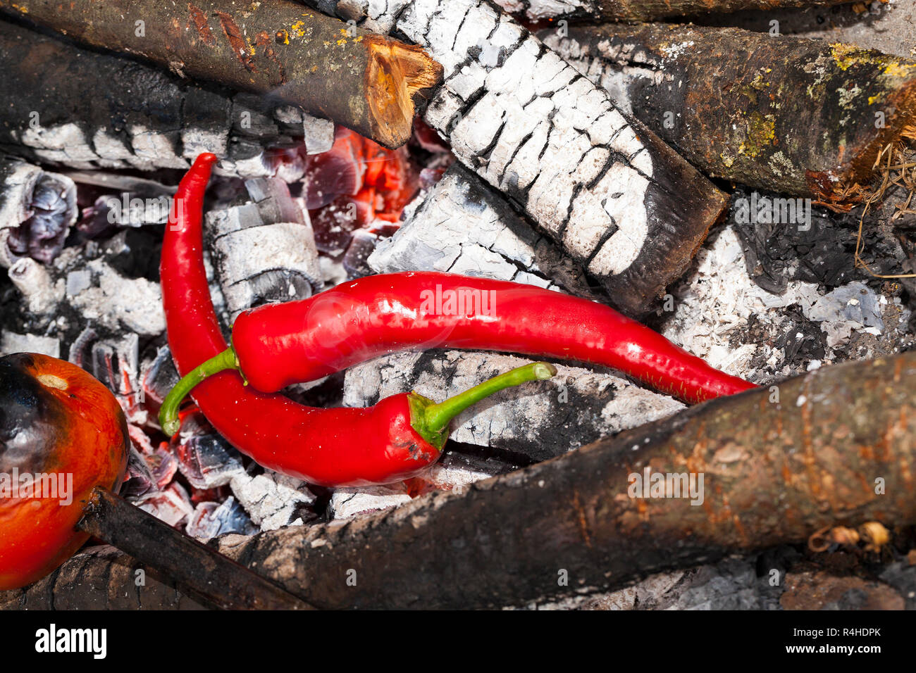preparing on a fire hot pepper Stock Photo - Alamy