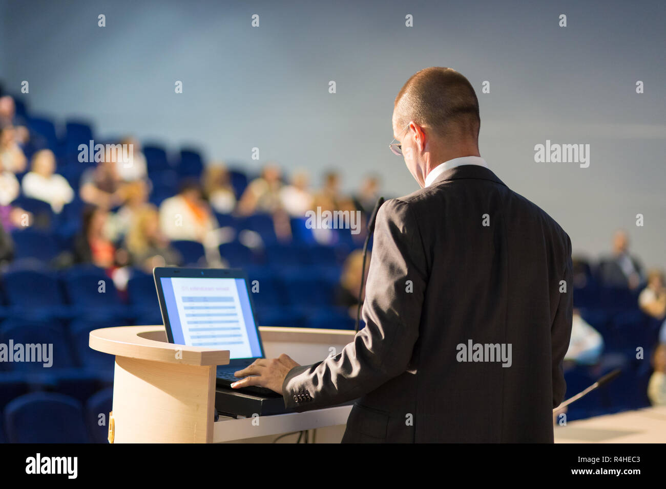 Public speaker giving talk at business event Stock Photo - Alamy