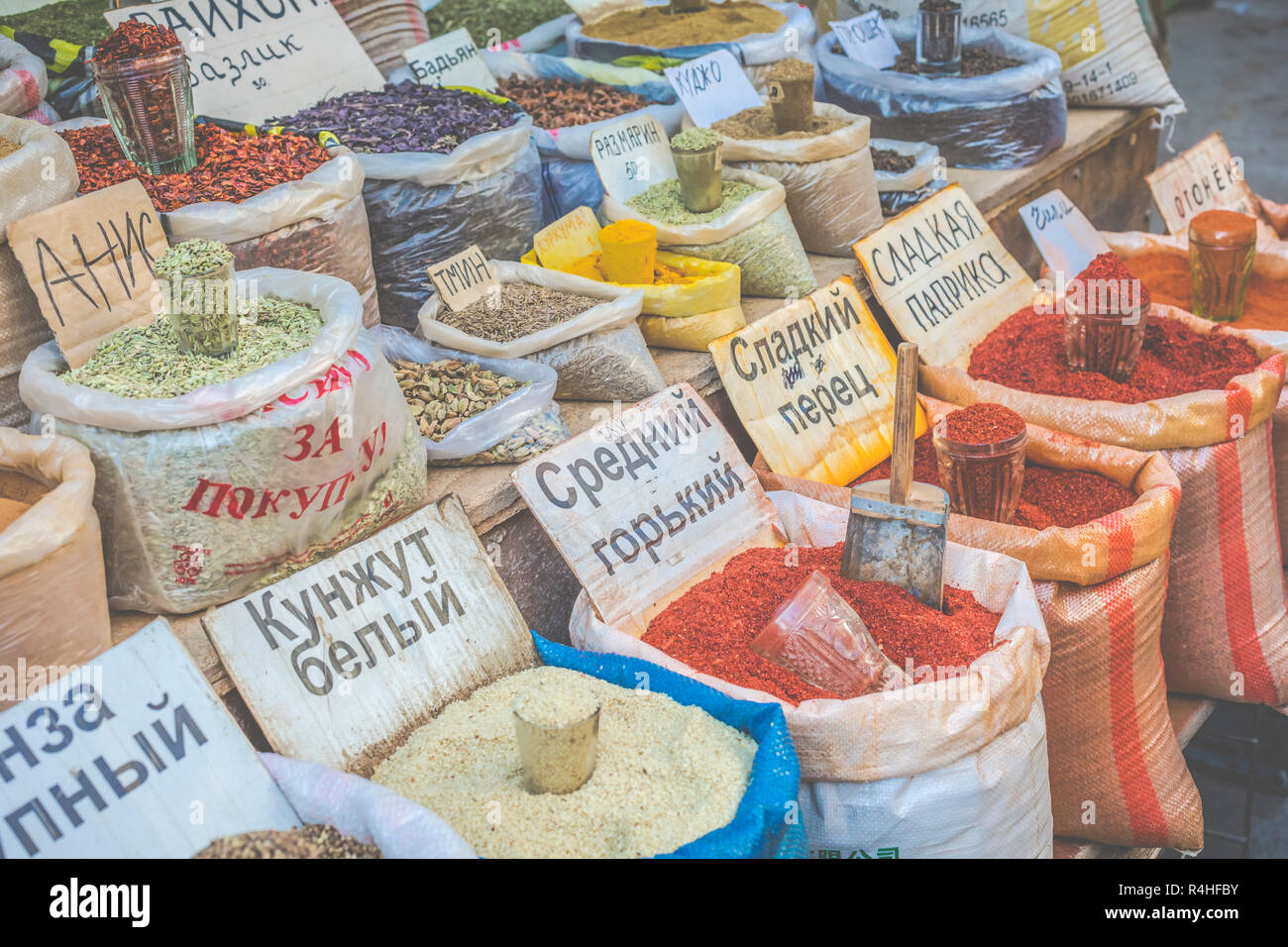 Vivid oriental central asian market with bags full of various spices in ...