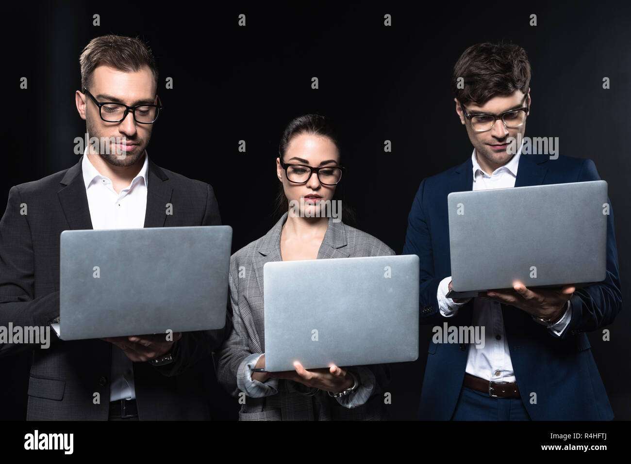 group of business people working with laptops together isolated on ...
