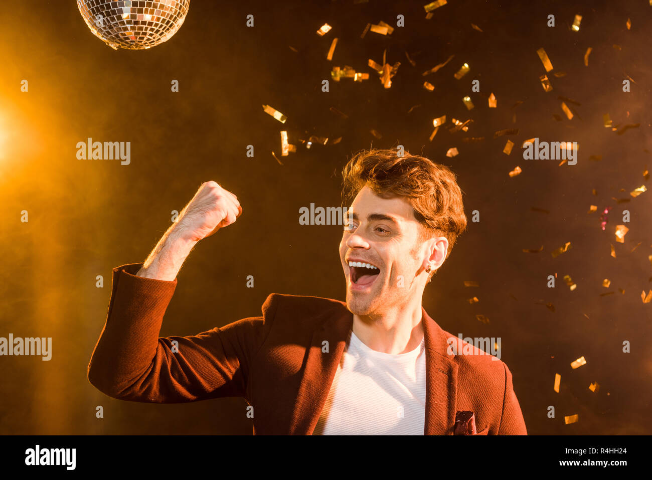 Happy young man celebrating hi-res stock photography and images - Alamy