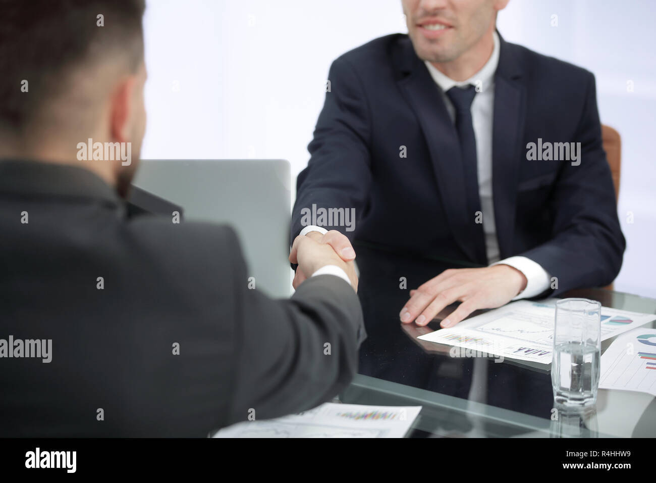 close up. handshake of business partners on a Desk Stock Photo - Alamy