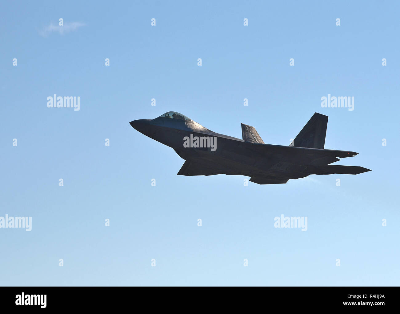 A U.S. Air Force F-22 Raptor from the 325th Fighter Wing flies over the ...