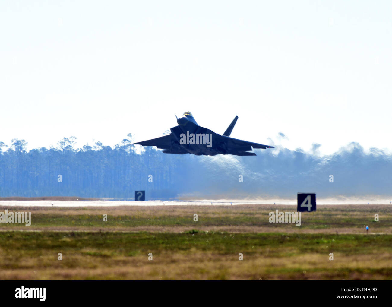 A U.S. Air Force F-22 Raptor from the 325th Fighter Wing flies down the ...